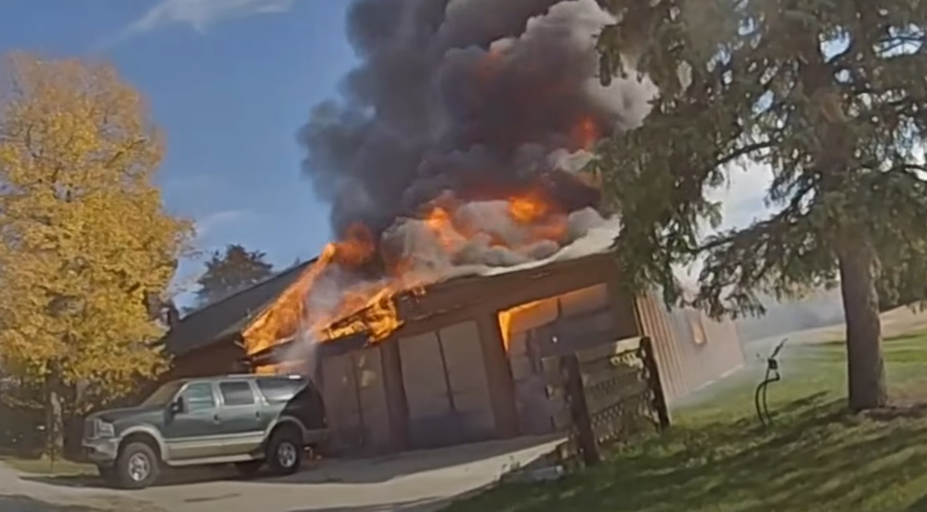 Caught on camera: Woman rescued from basement of burning Ohio home ...